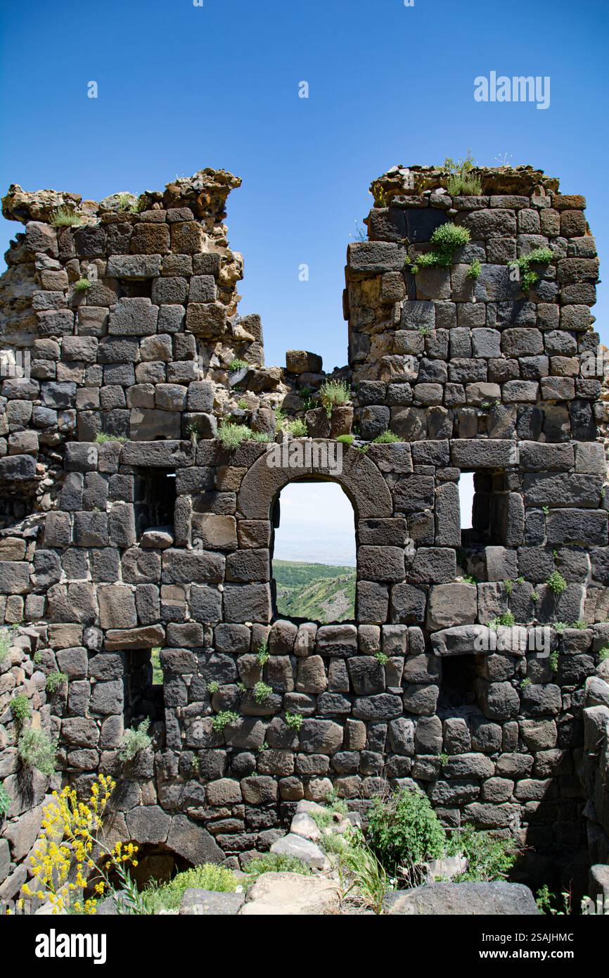 Old castle wall ruins. Caste window and church. Ruins of castle ...