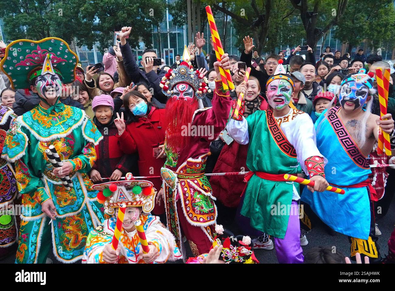 Performers from a Shantou Yingge Opera troupe pose for photos during a ...