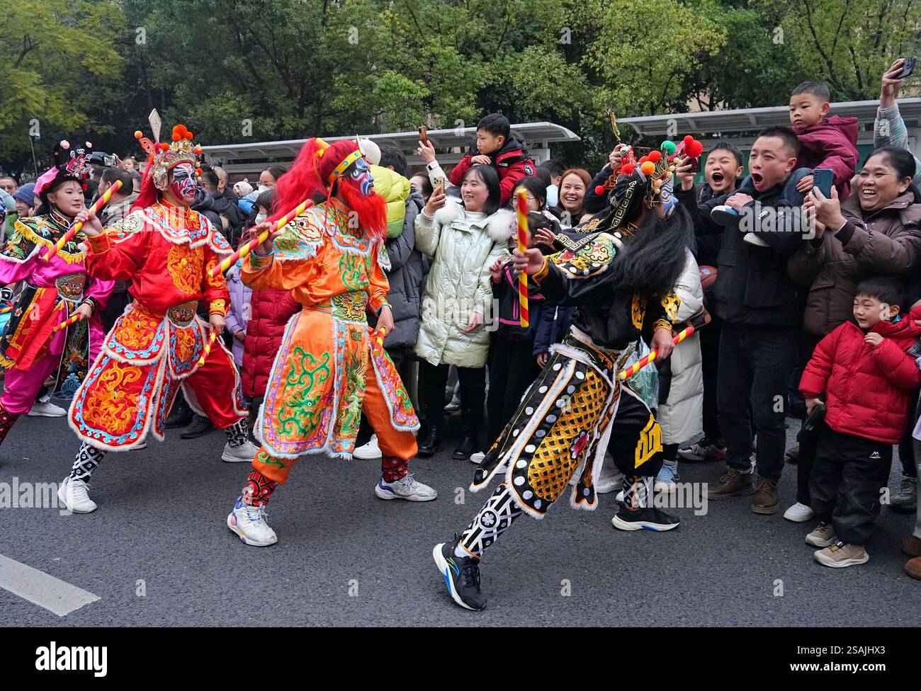 Performers from a Shantou Yingge Opera troupe perform during a parade ...