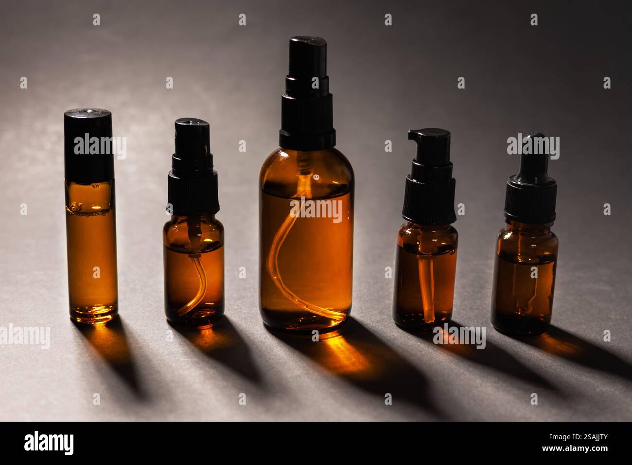 amber bottles with dropper pipettes for cosmetology Stock Photo - Alamy