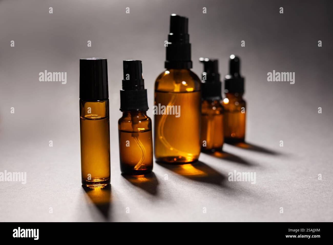 amber bottles with dropper pipettes for cosmetology Stock Photo - Alamy