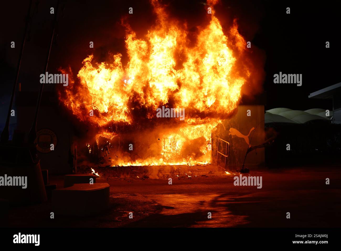 A Manchester City merchandising stall seen on fire during Manchester ...