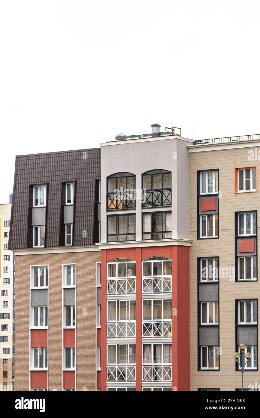 Contemporary apartment building with varied facade styles and balconies ...
