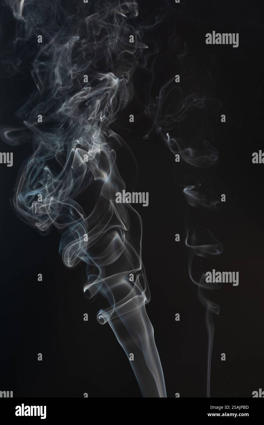 Smoke shape effect isolated on black studio background Stock Photo - Alamy