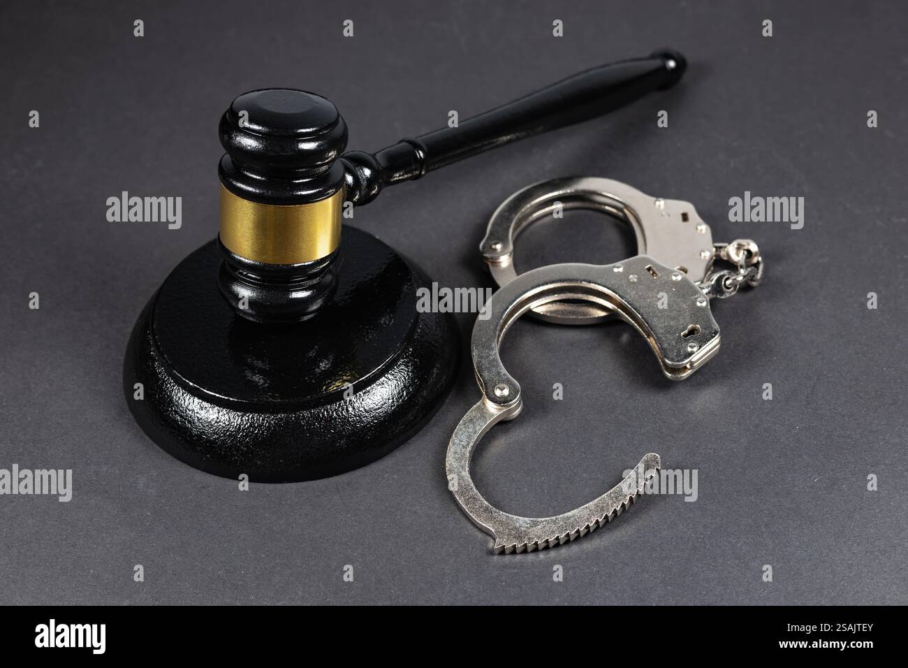 Mallet handcuffs on table hi-res stock photography and images - Alamy