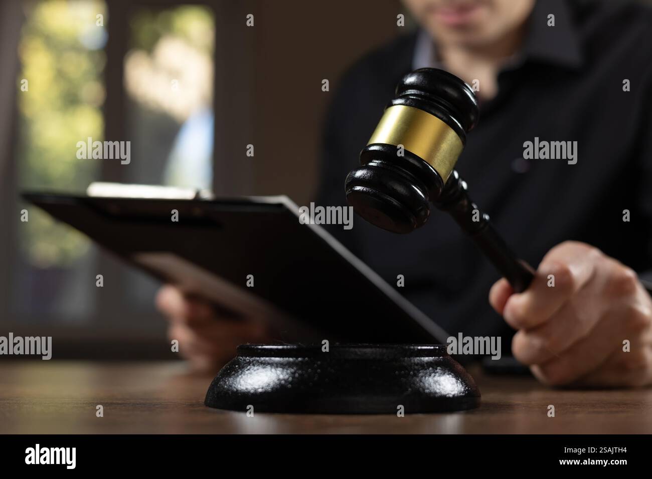 Judge with paper document pronouncing sentence in a court of law. Judge ...