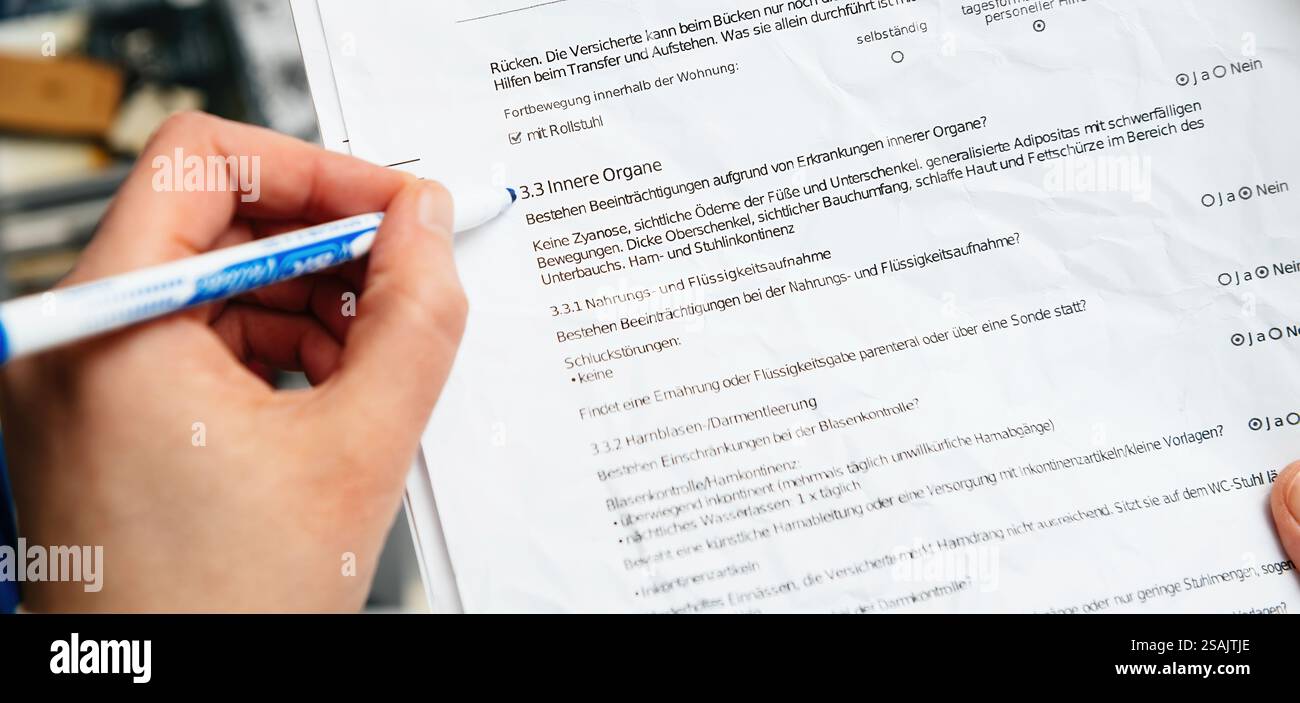 A medical professional marks responses on a form assessing internal ...