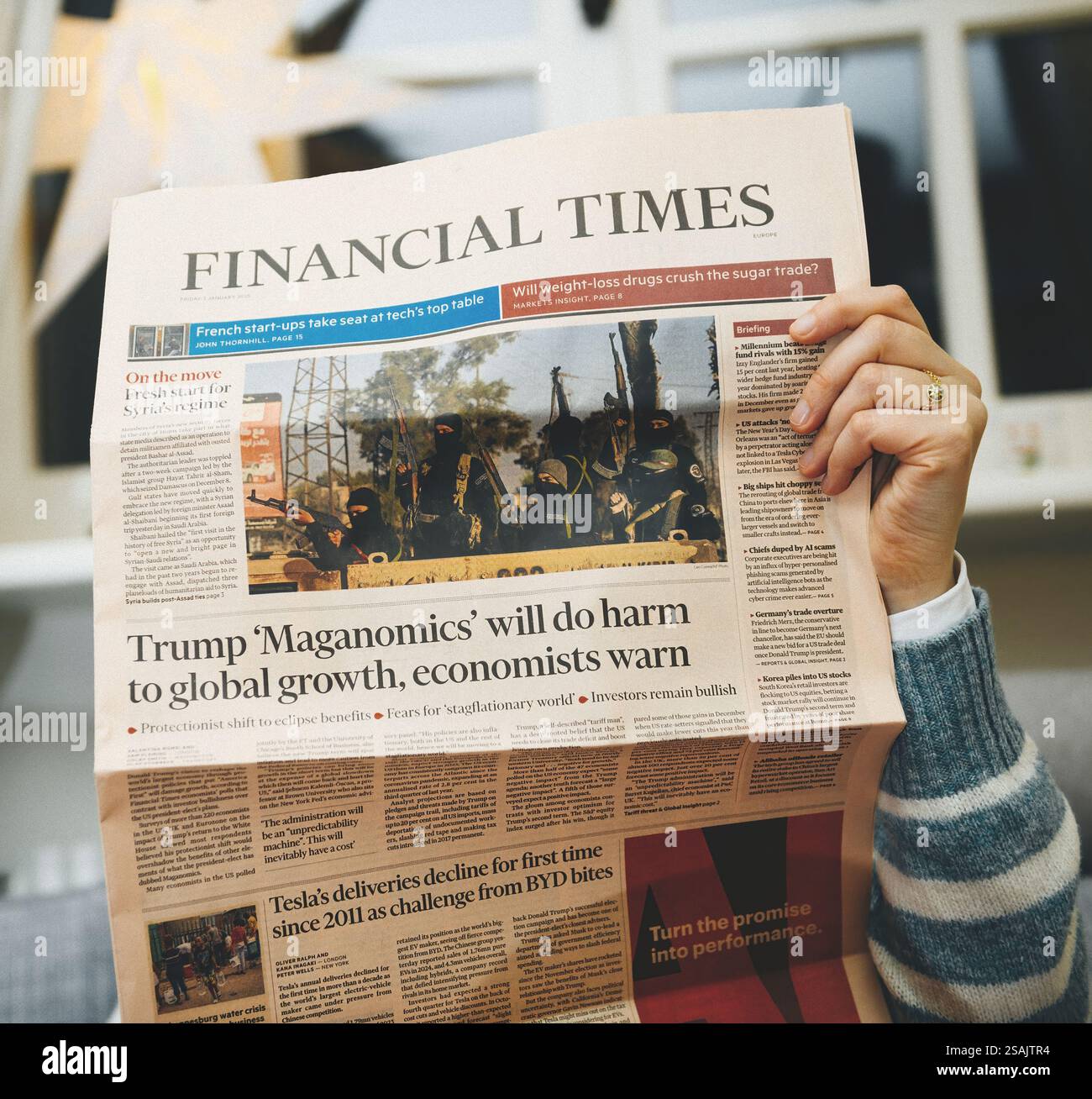 Paris, France - Jan 10, 2025: A woman reading the Financial Times ...