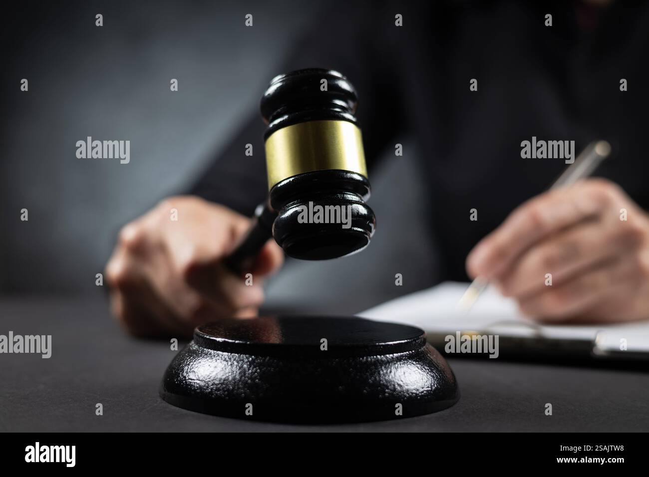 Judge with paper document pronouncing sentence in a court of law. Judge ...