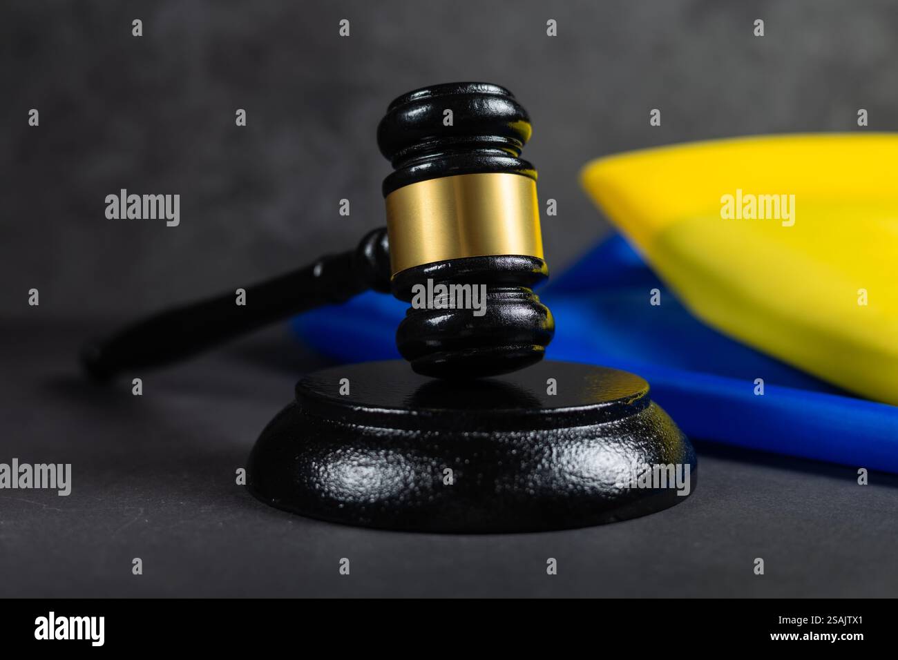 Judge gavel and flag of Ukraine on dark background. Blue yellow ...