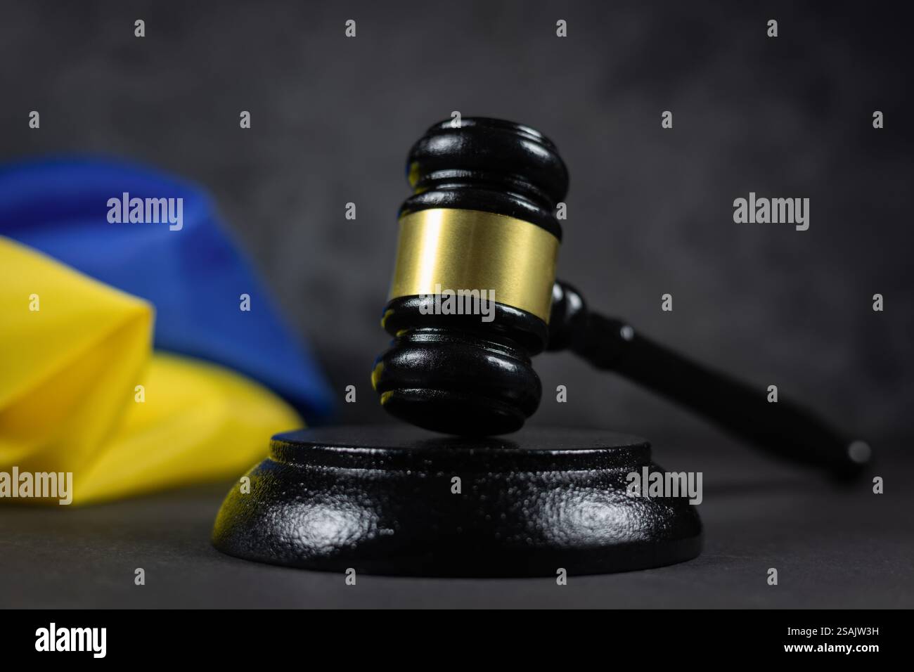 Judge gavel and flag of Ukraine on dark background. Blue yellow ...