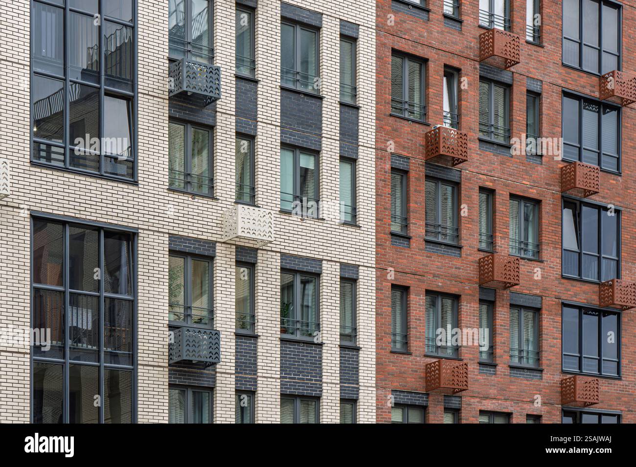 Contemporary multi-story buildings with beige, red brick and glass ...