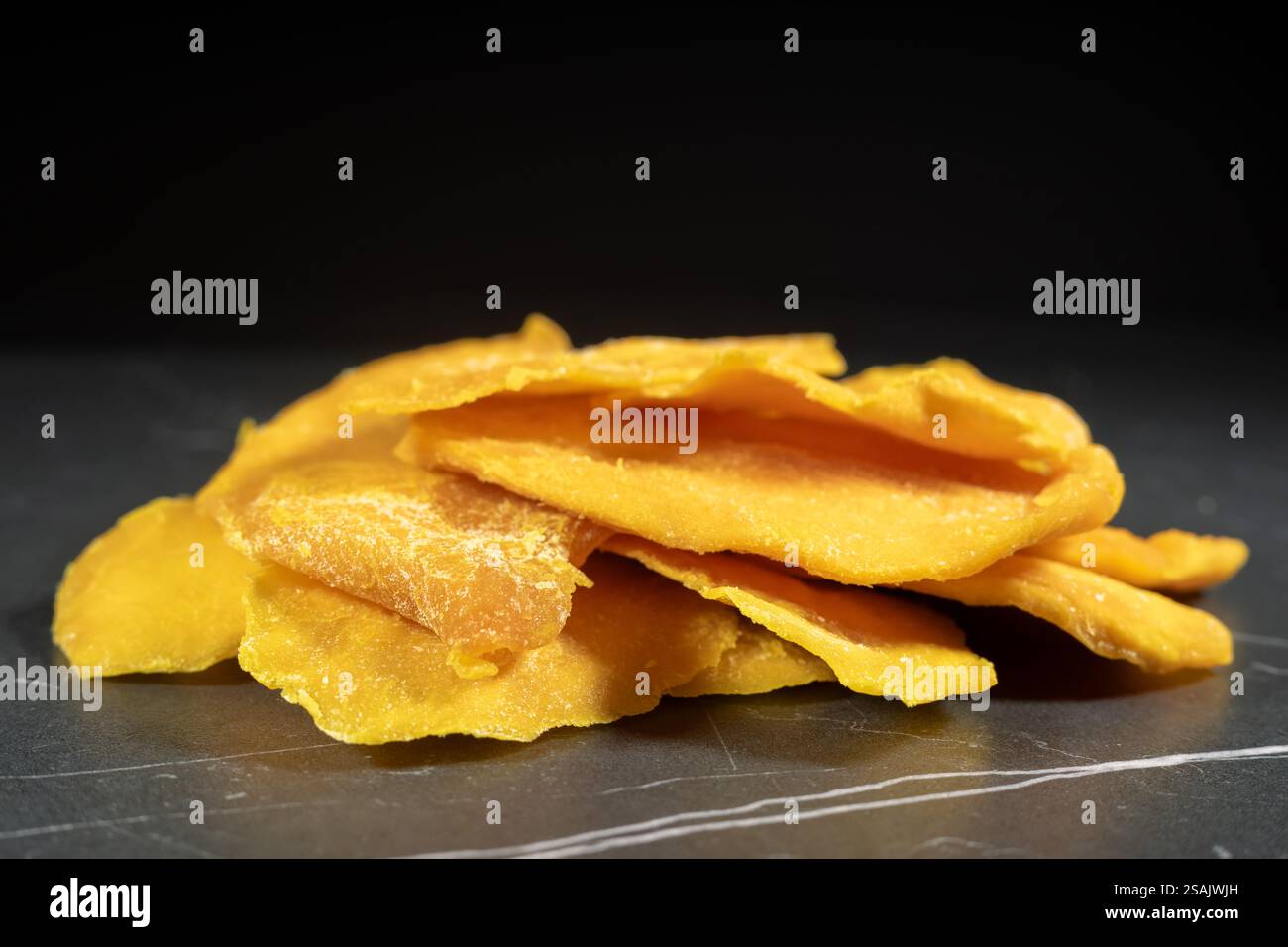 Sliced Dried Mango, Dried Fruit. Candied fruits, mango pieces. Heap of ...