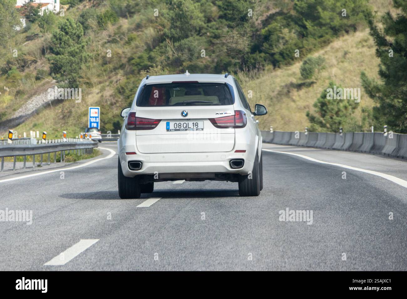 Rear view of white bmw x5 driving on highway in portugal Stock Photo ...