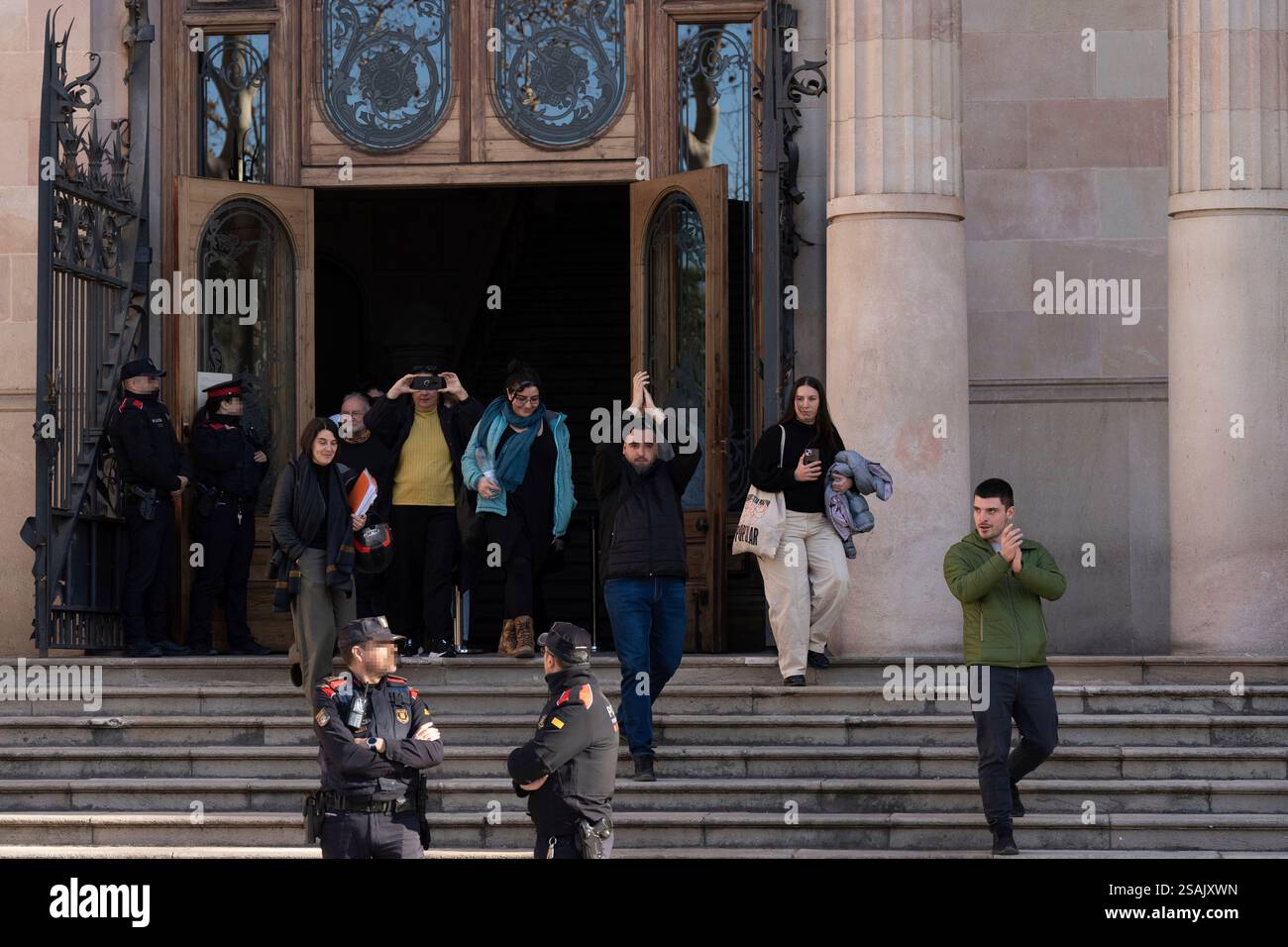 The defendants leave the Barcelona Court during a rally in support of ...