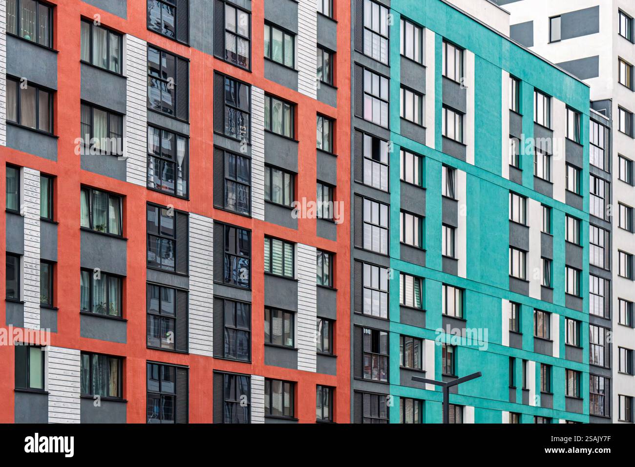 Red and teal modern building exteriors with geometric patterns, dark ...