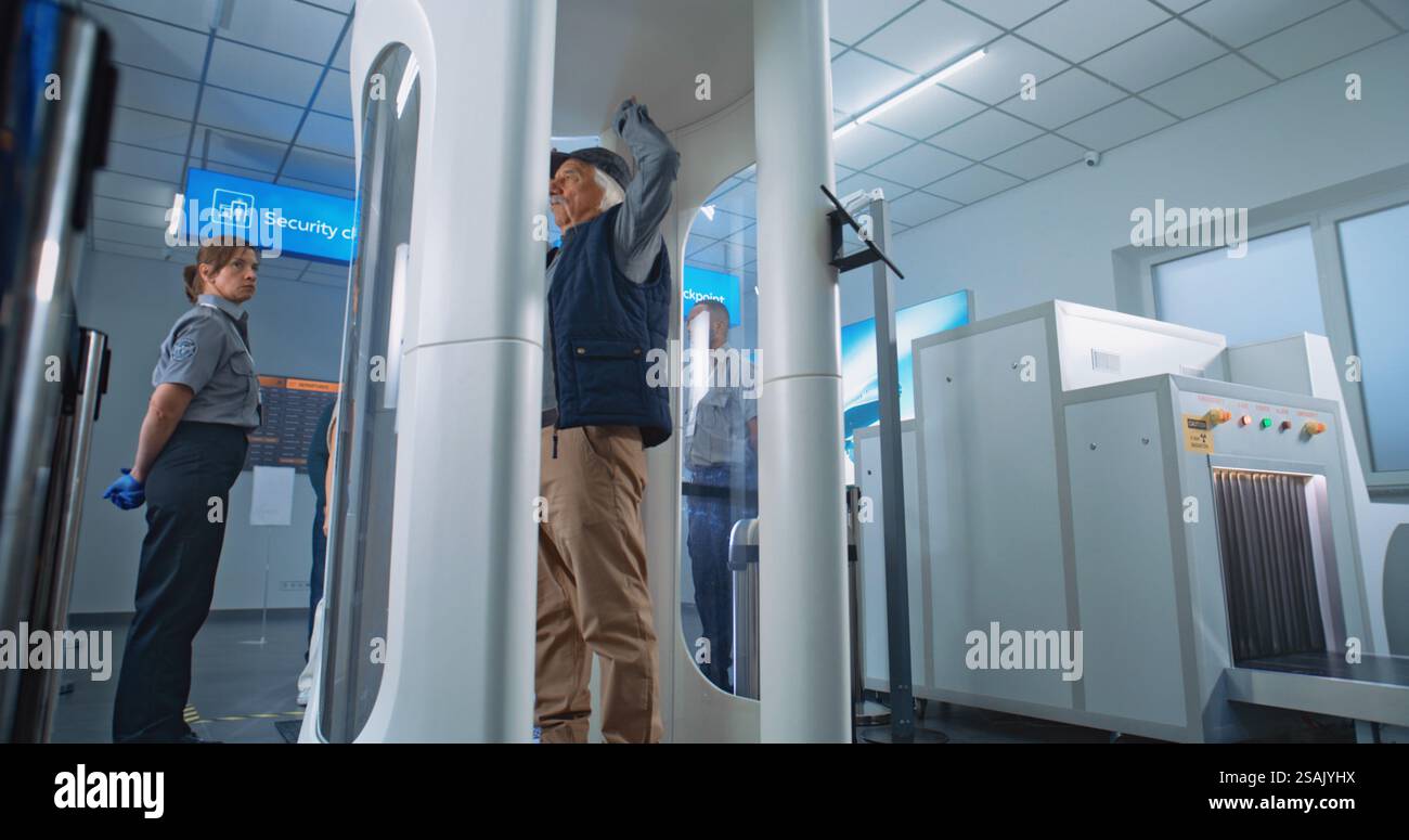 Diverse people passing through metal hi-res stock photography and ...