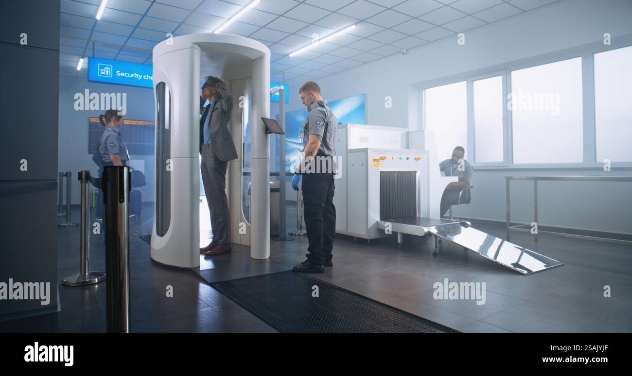 Airport Terminal: Mature Businessman Walks Through Metal Detector ...