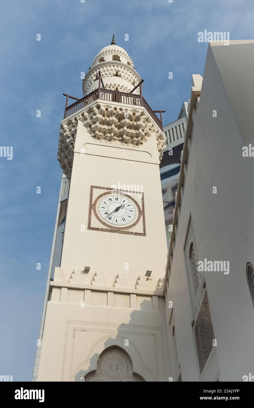 Abdulla Ali Yateem Mosque square minaret with four clocks and decorate ...