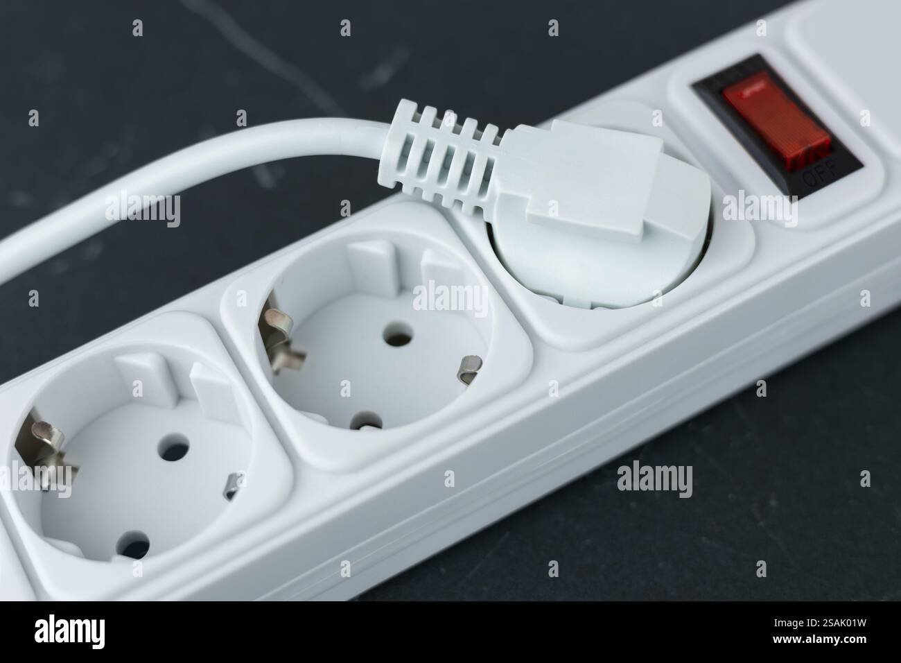 Surge protector with plugs on white background. plug in the network ...