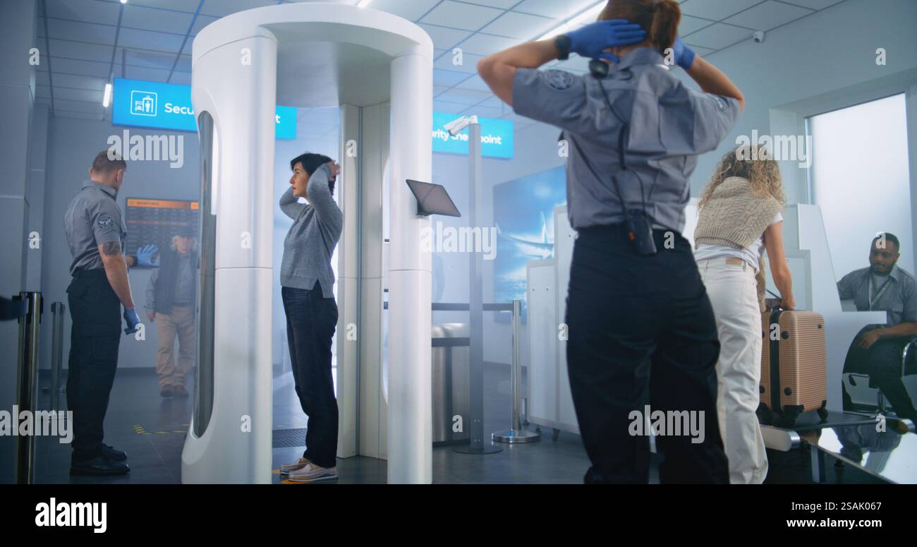 Airport Terminal: Woman Passes Through Metal Detector Scanner Gates on ...