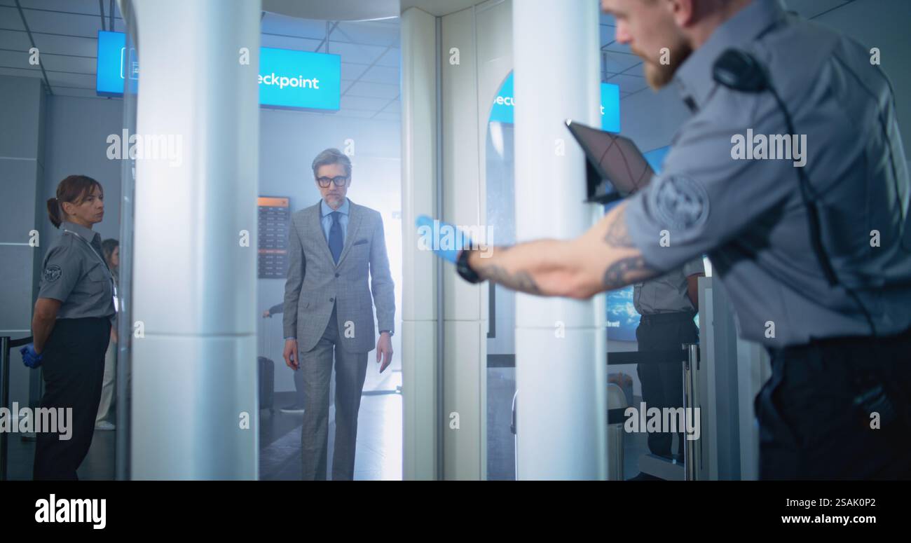 Airport Terminal: Mature Man Passes Through Metal Detector Scanner on ...
