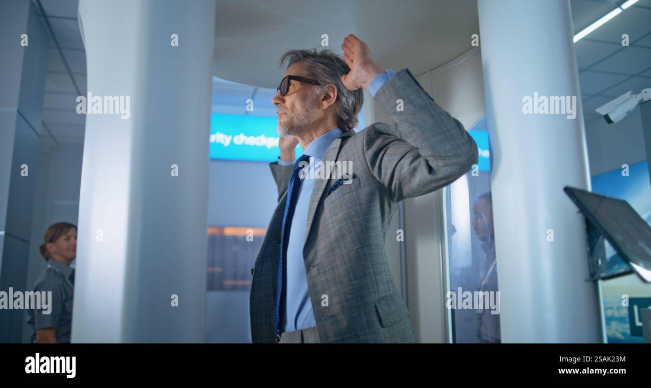 Airport Terminal: Mature Man Walks Through Metal Detector Gates on ...