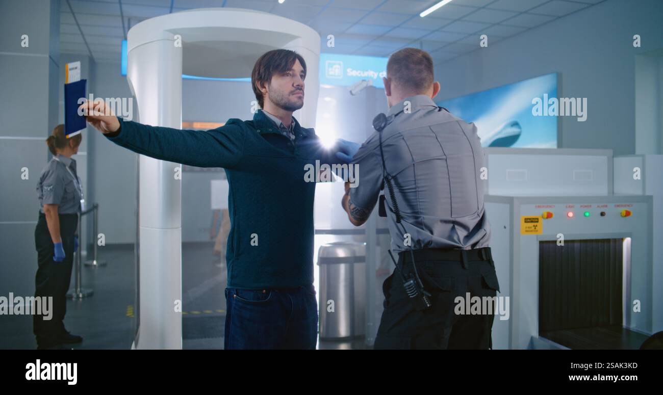Airport Terminal: Man Passes Through Metal Detector Scanner on Security ...