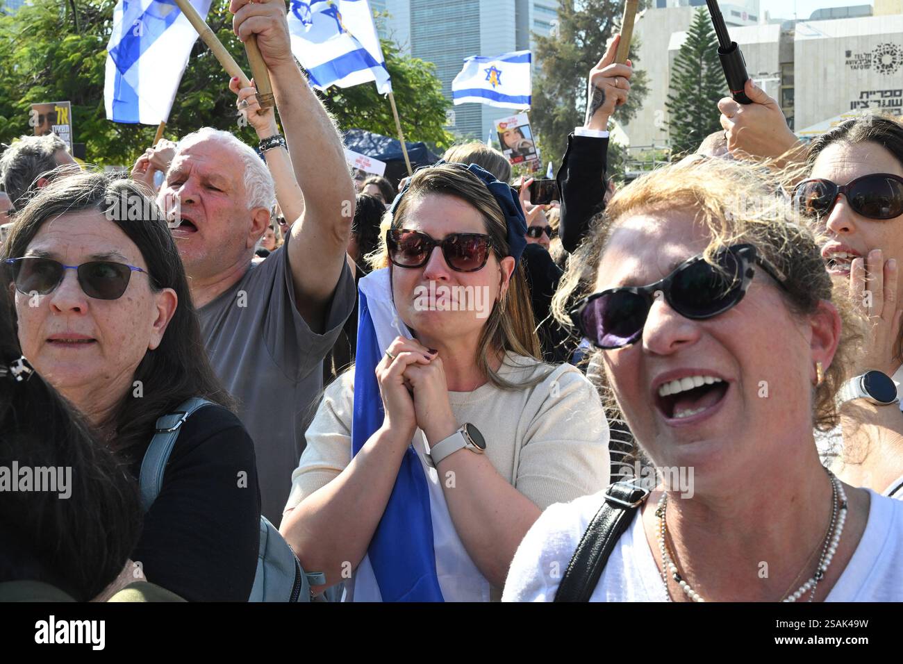 People watch on a large screen in Hostage Square in Tel Aviv, the ...