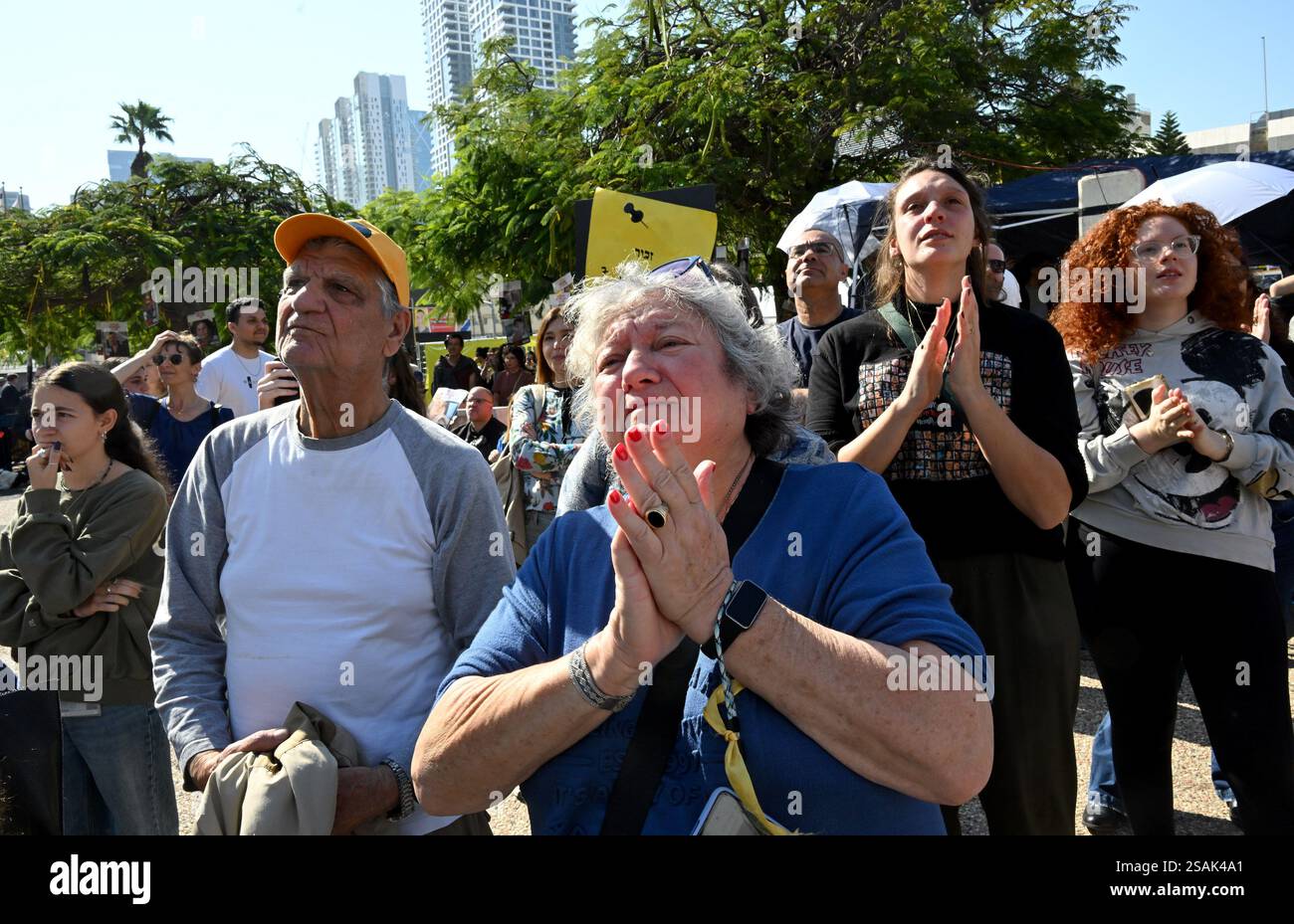Tel Aviv, Israel. 30th Jan, 2025. People watch on a large screen in ...