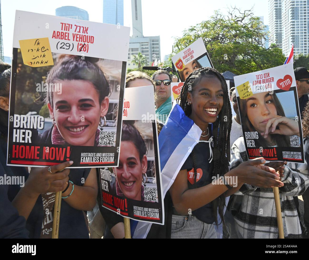 Tel Aviv, Israel. 30th Jan, 2025. People watch on a large screen in ...