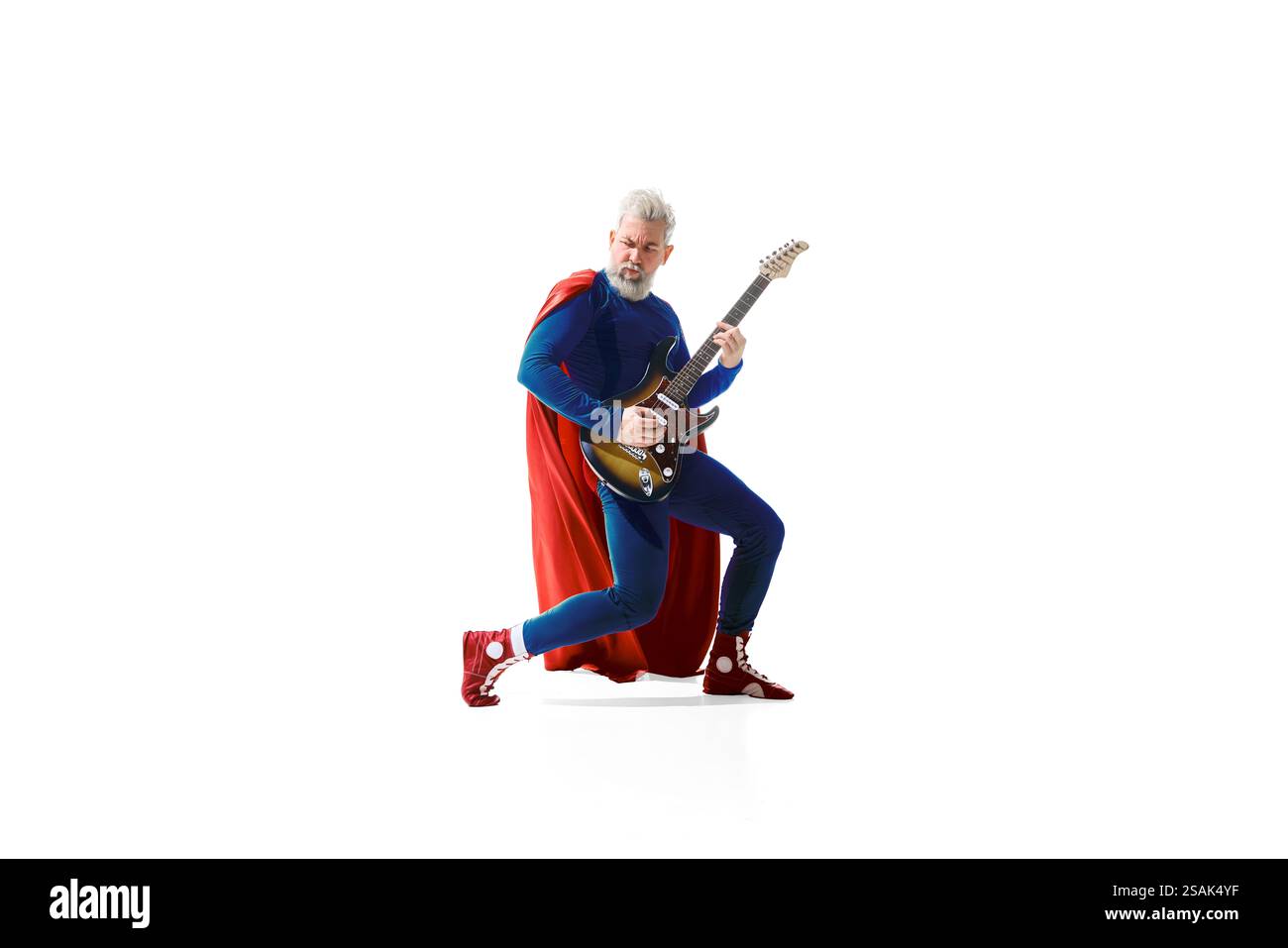 Grey-haired young man in superhero costume playing electric guitar ...