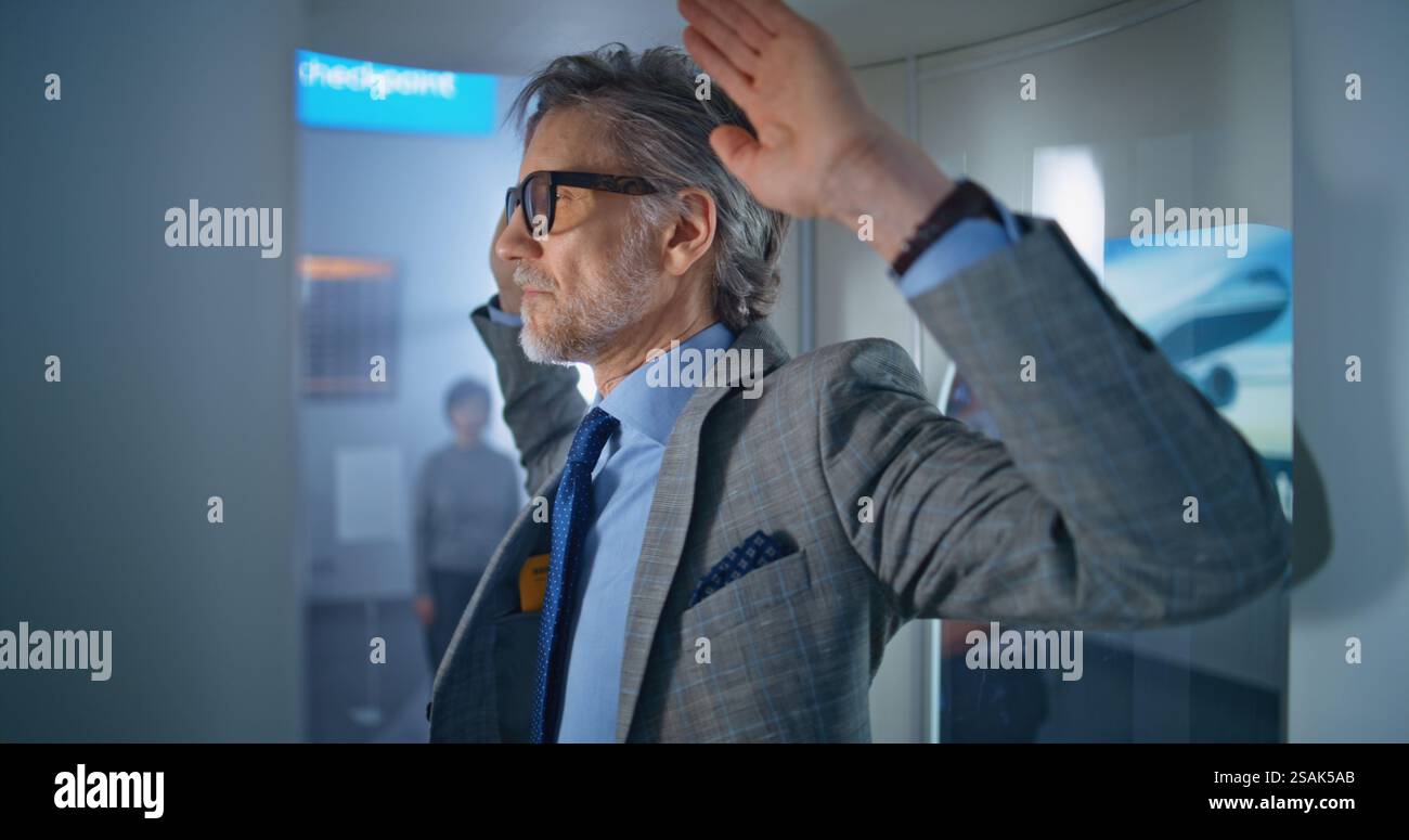 International Airport Terminal: Mature Businessman Walks in Metal ...