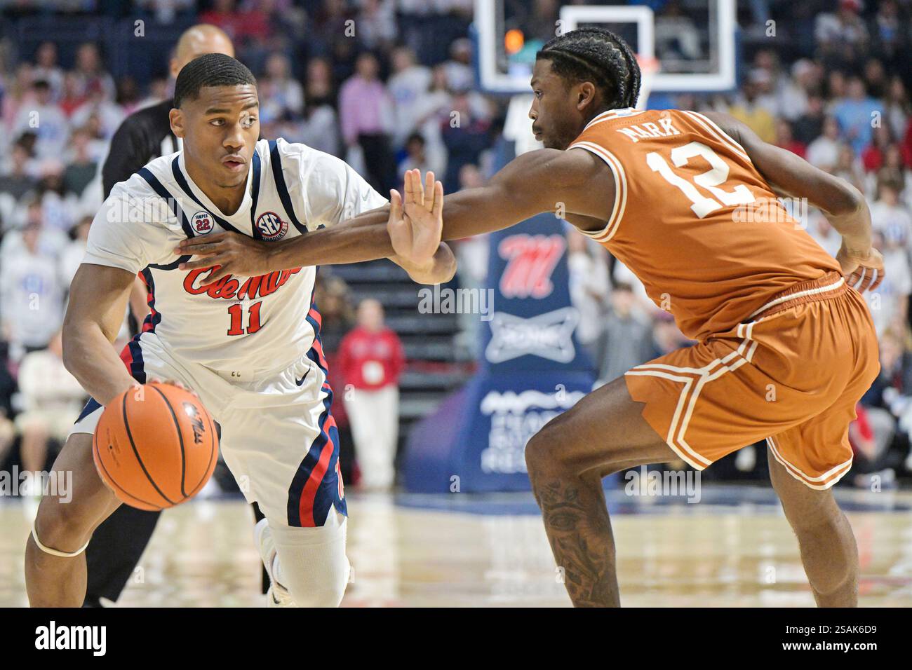 Mississippi guard Matthew Murrell (11) is fouled by Texas guard Tramon ...