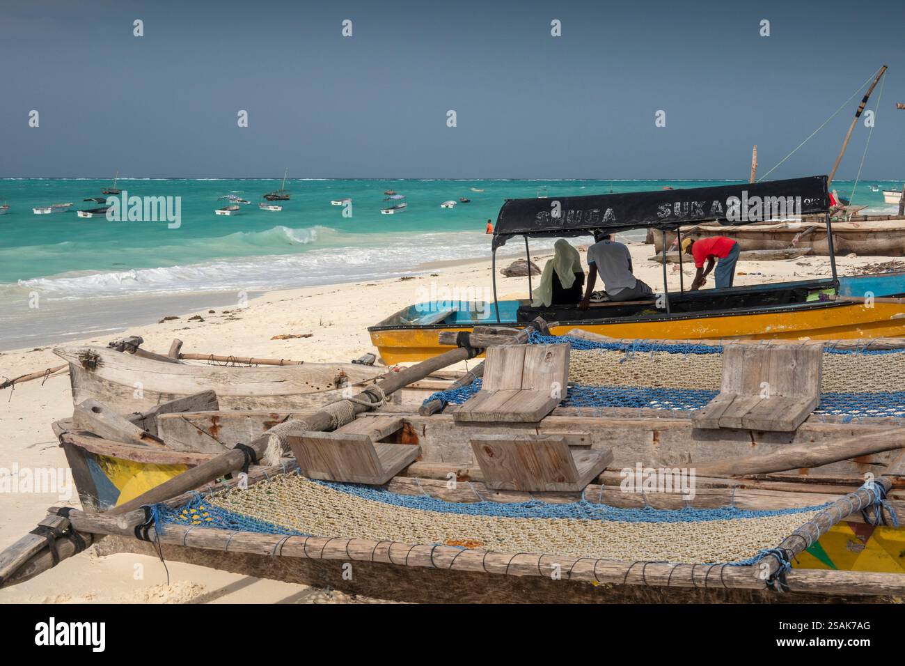 Africa Tanzania, Zanzibar, Nungwi, beach, approaching high tide, boats ...
