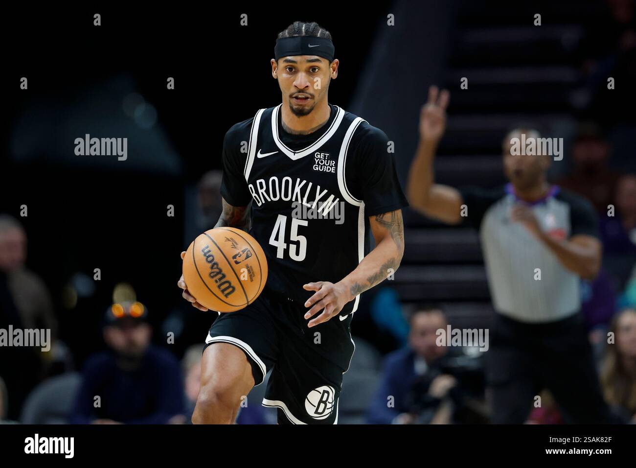 Brooklyn Nets guard Keon Johnson brings the ball upcourt against the ...