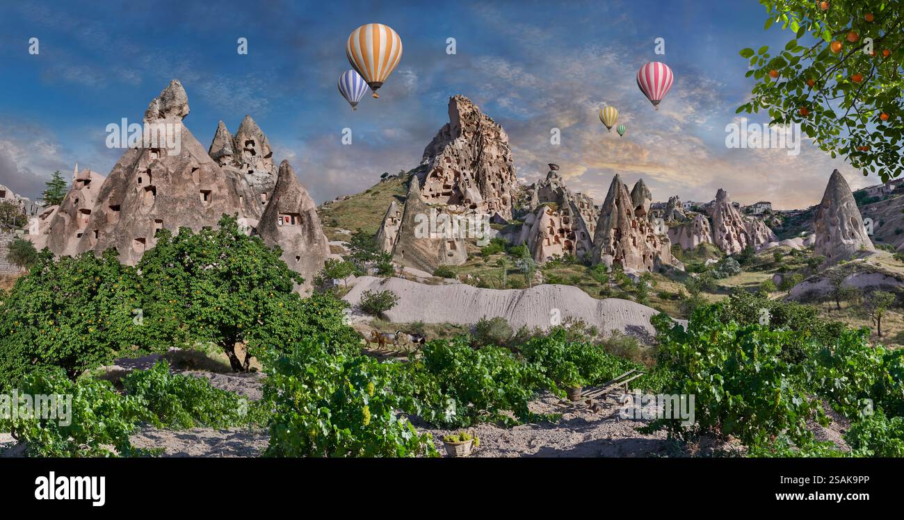 Hot air balloons flying tourists over Uchisar castle Fairy Chimney rock ...
