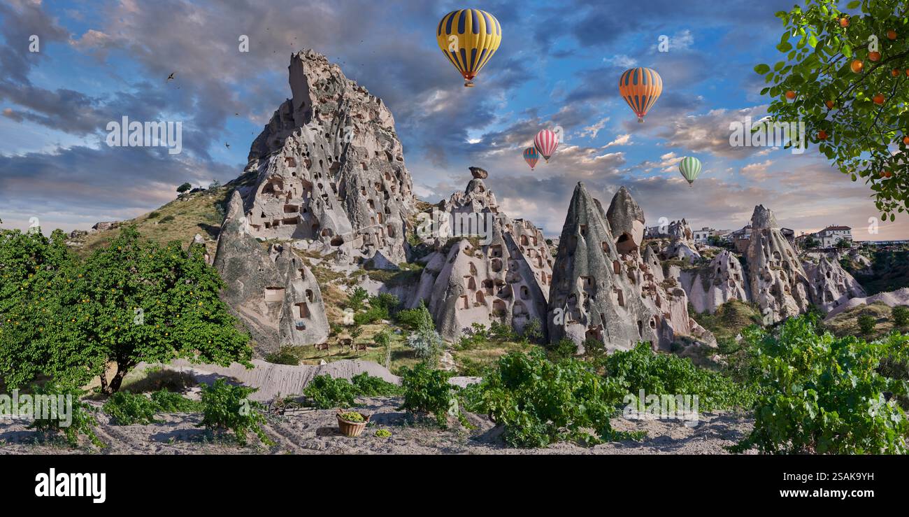 Hot air balloons flying tourists over Uchisar castle Fairy Chimney rock ...