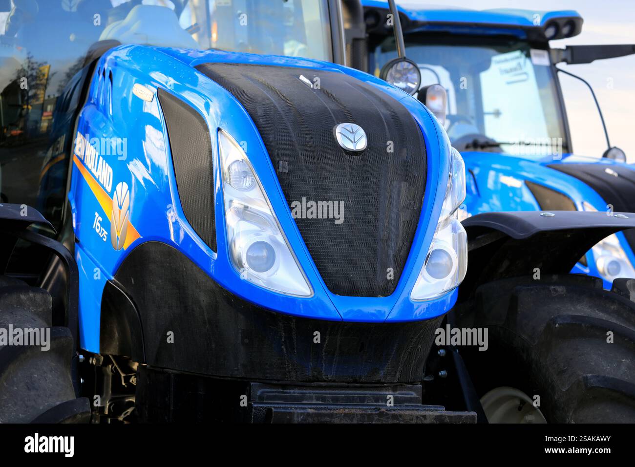 New Holland T6.175 all-purpose tractor parked at the dealership, front ...