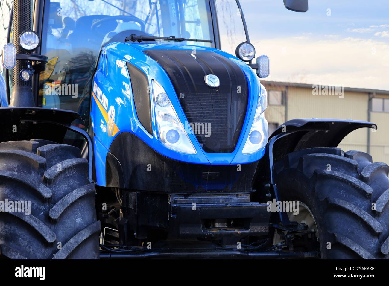 New Holland T6.180 all-purpose tractor parked at the dealership, front ...