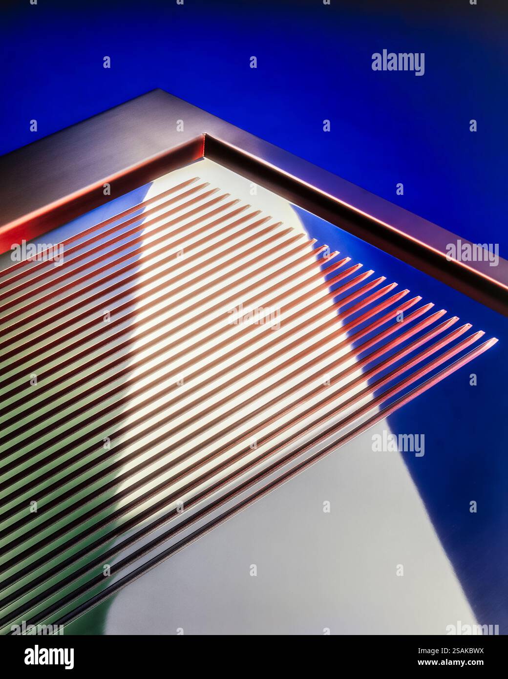 Abstract close-up of an industrial kitchen grill with metallic slats ...