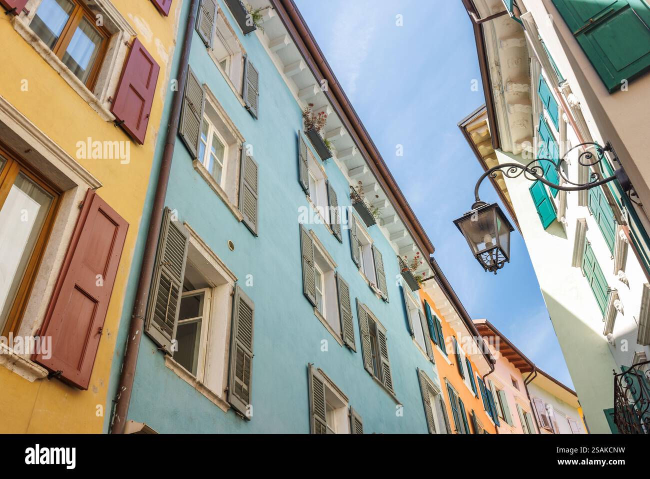 Colorfull buildings in a street of the Riva del Garda, town on the ...