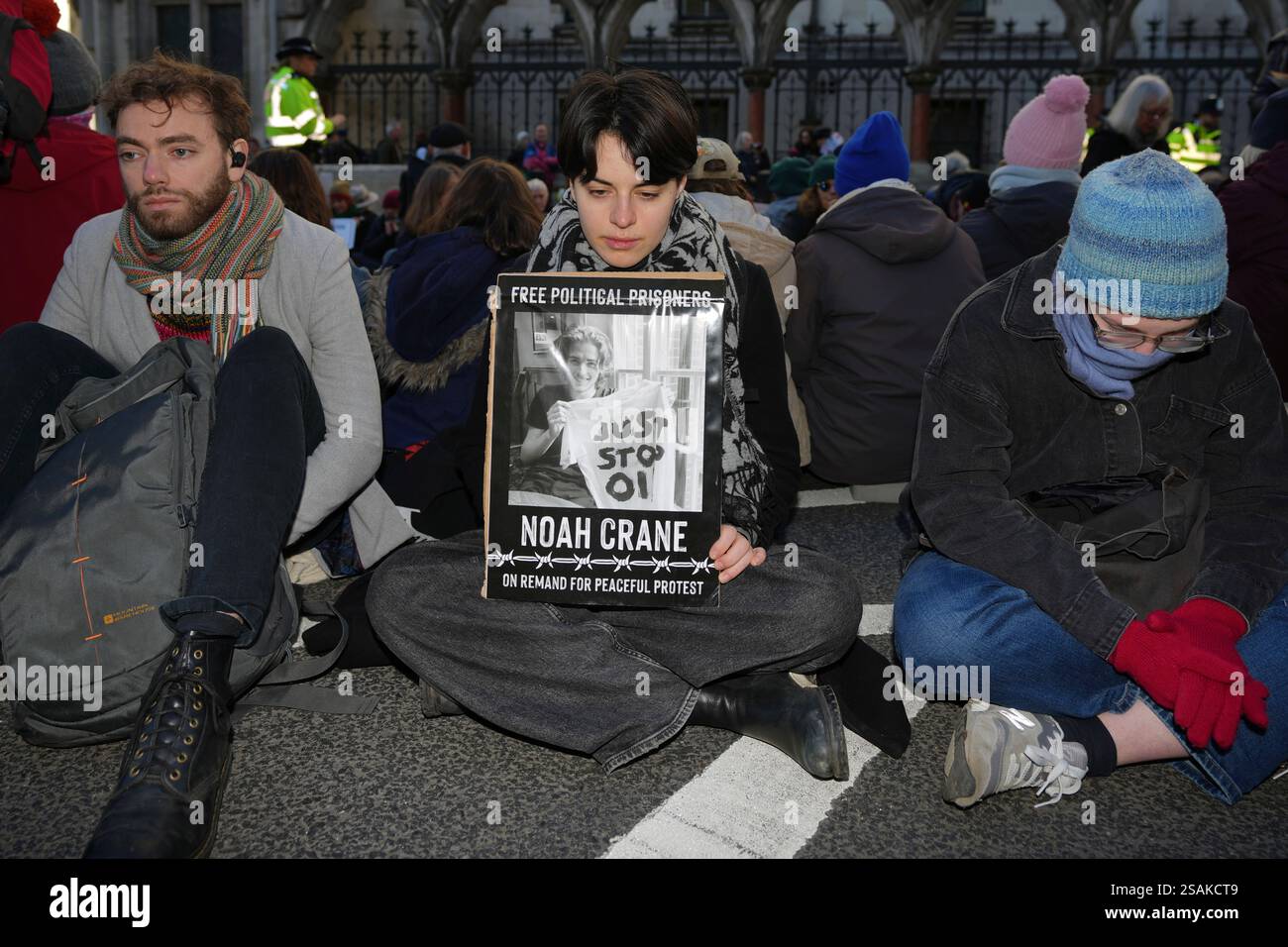 Climate activists block the road during a protest outside The Royal ...