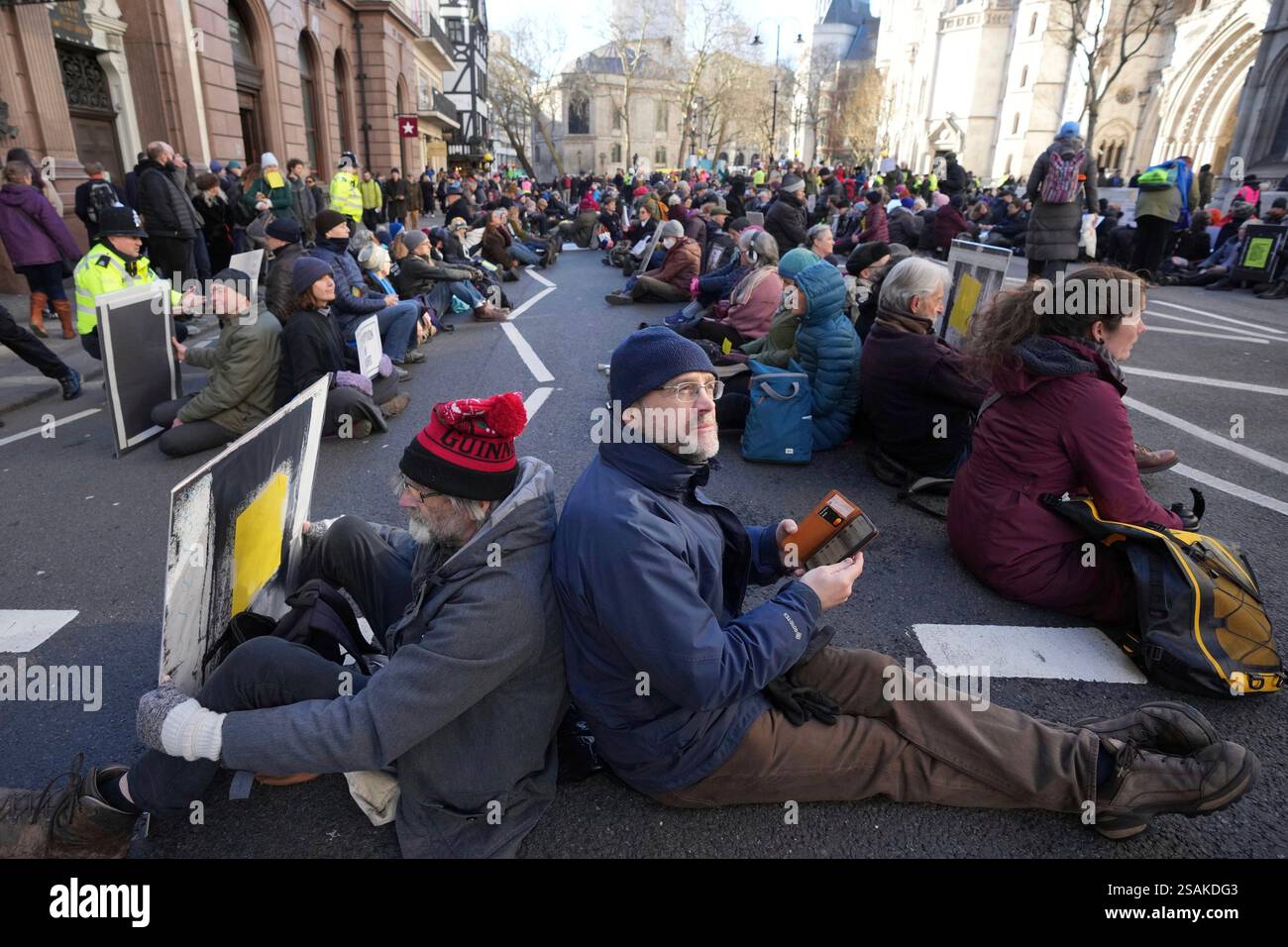Climate activists block the road during a protest outside The Royal ...