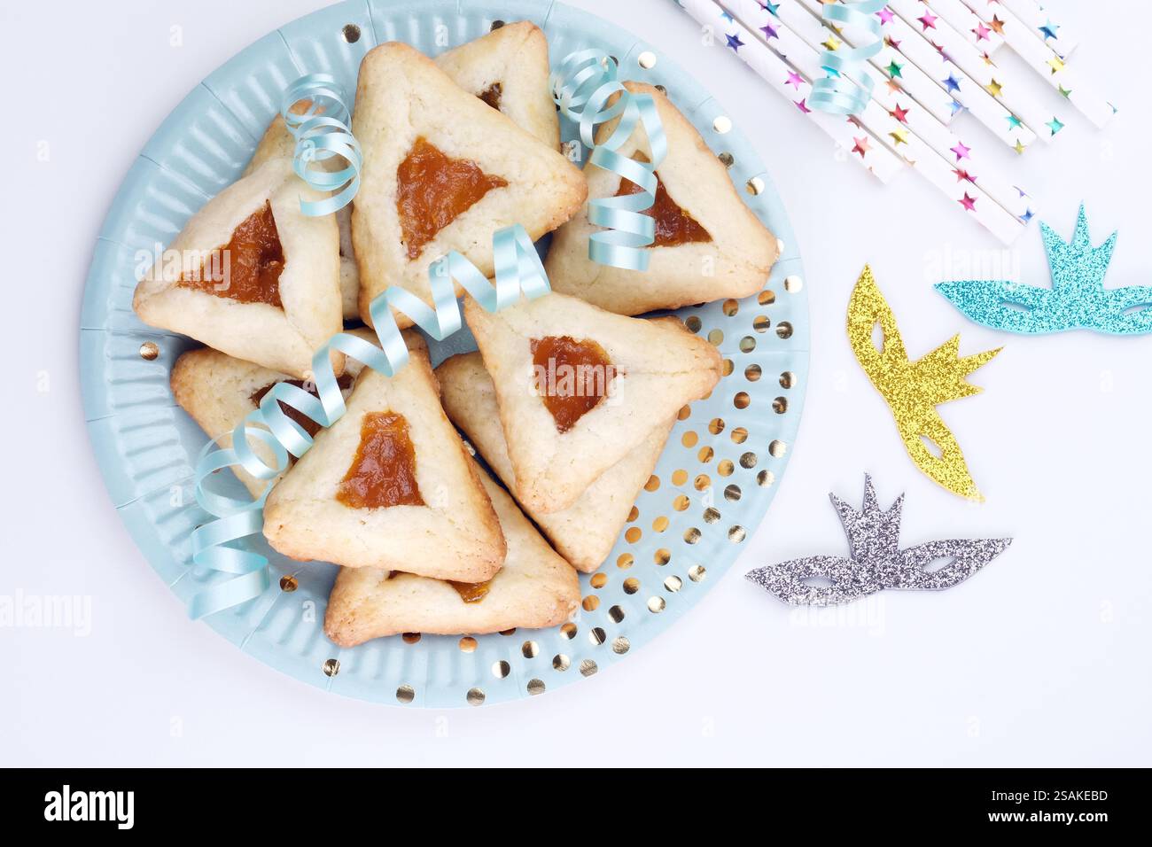 Close up freshly baked triangular cookies, adorned with light blue ...
