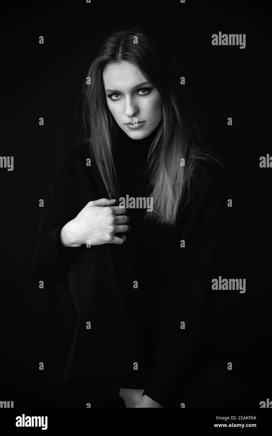 A striking black and white portrait of a woman with deep shadows and ...