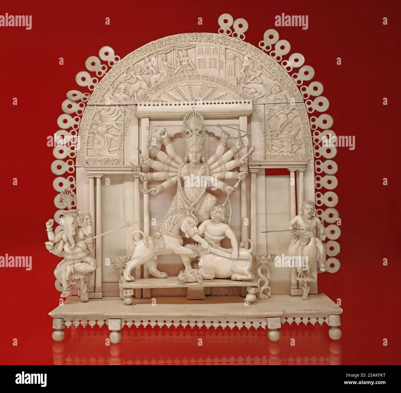 Carved ivory depicting. Durga subduing the buffalo demon Stock Photo ...