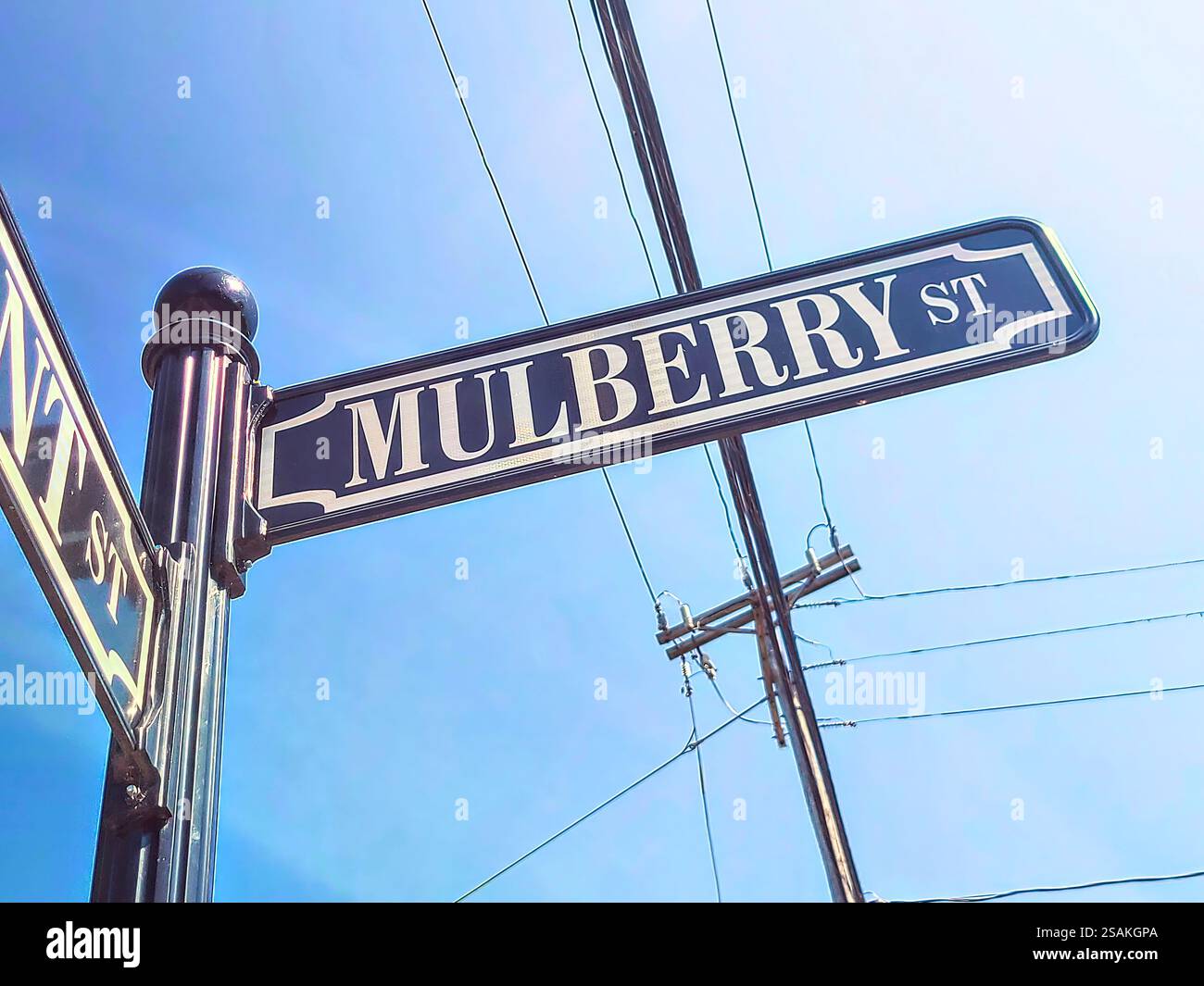 Mulberry St Sign with Urban Utility Lines Against Clear Sky Low Angle ...