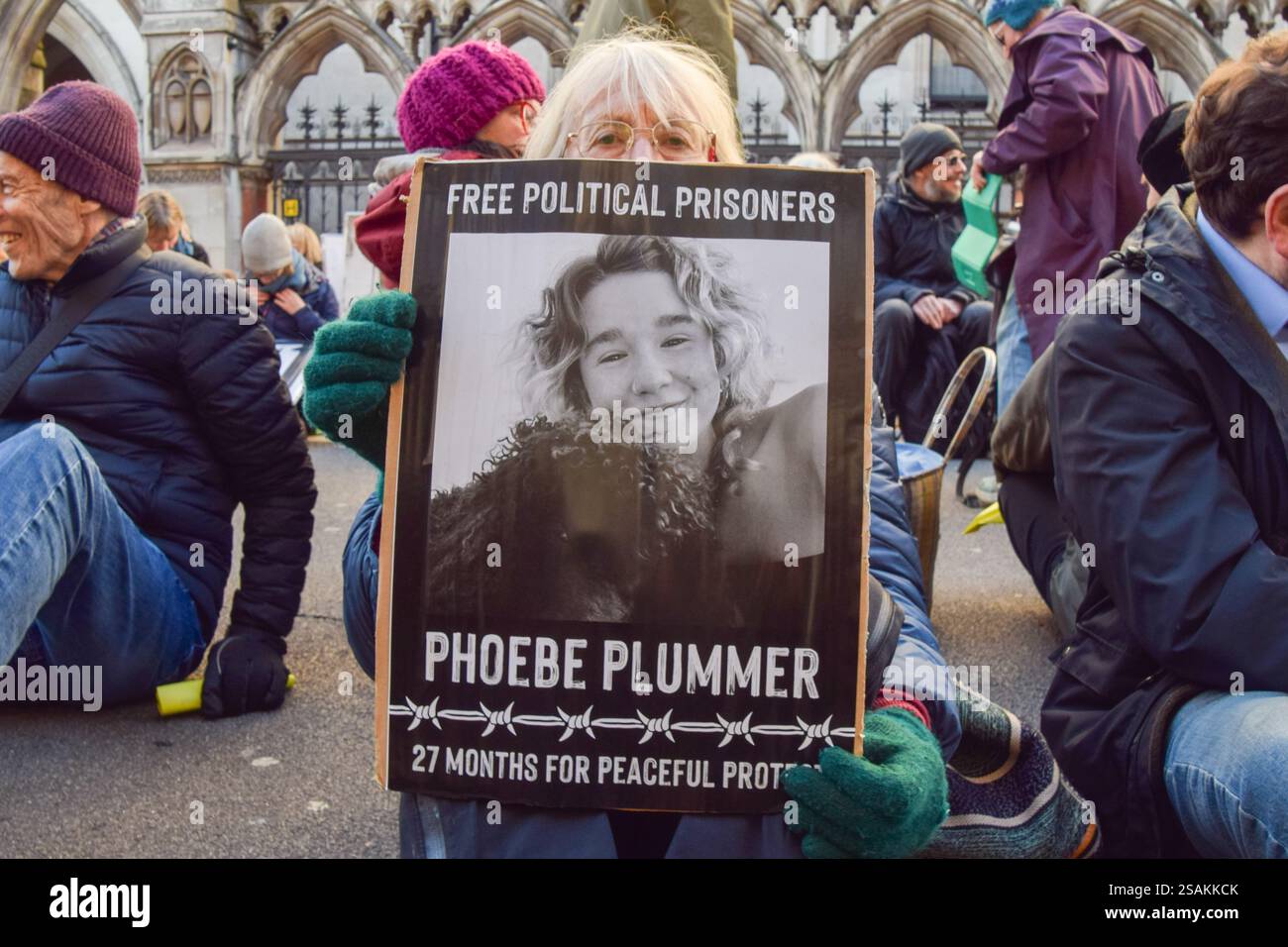 January 30, 2025, London, England, UK: A protester holds a picture of ...