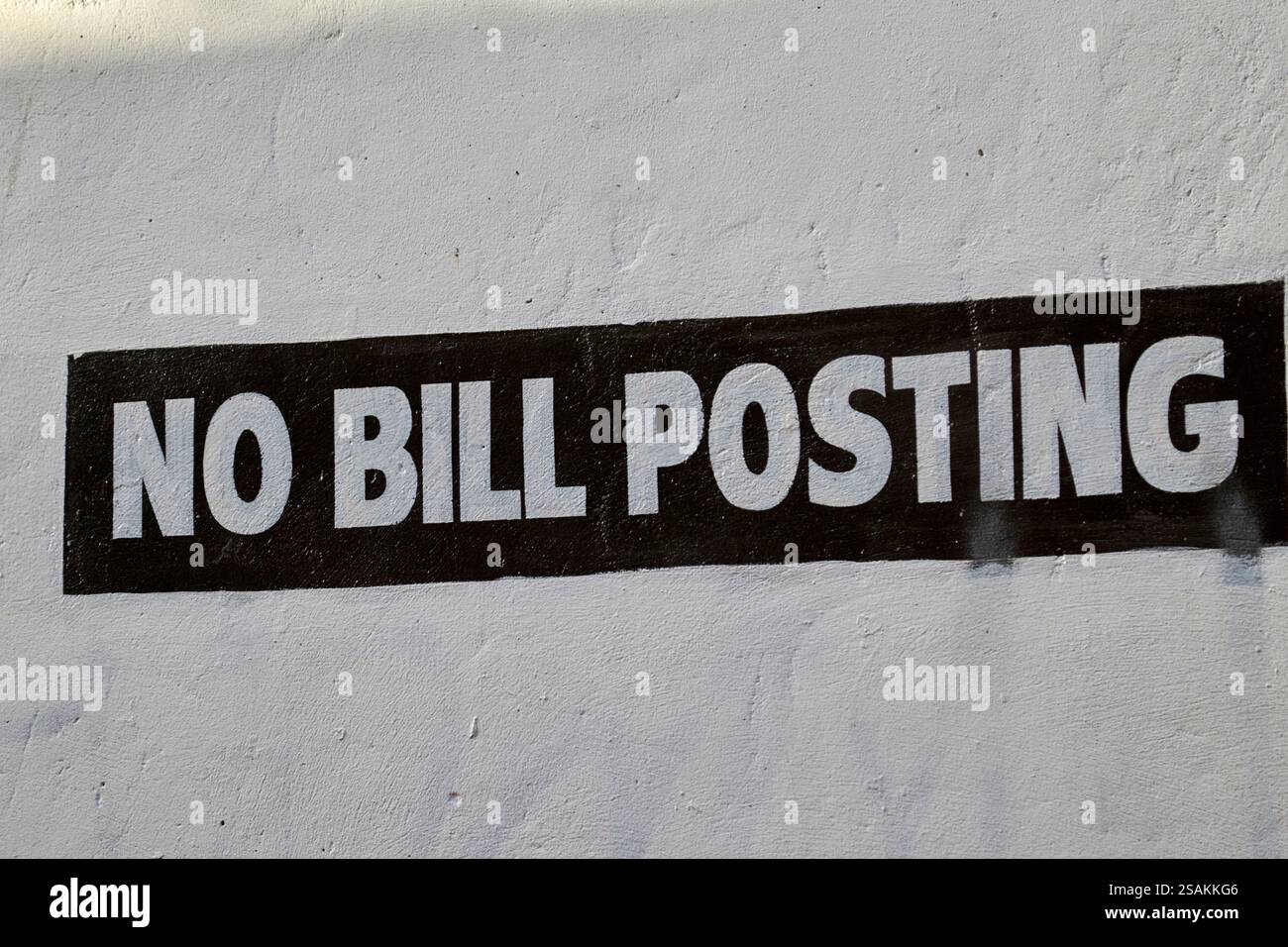 no bill posting sign on a white wall in belfast, northern ireland, uk ...